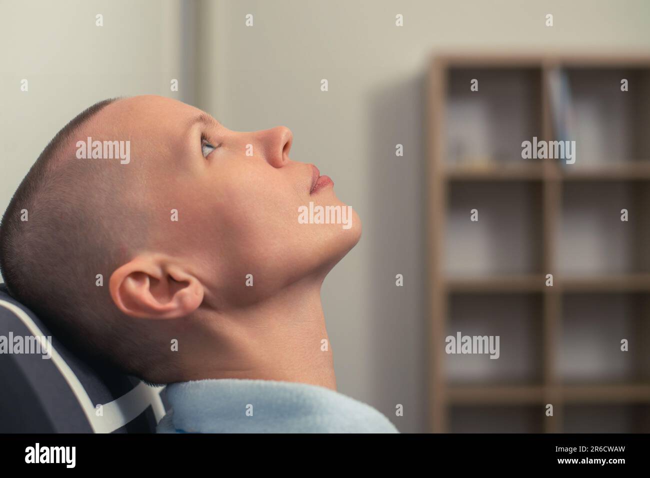 Bald woman in thought. Middle-aged woman without hair in reflection ...