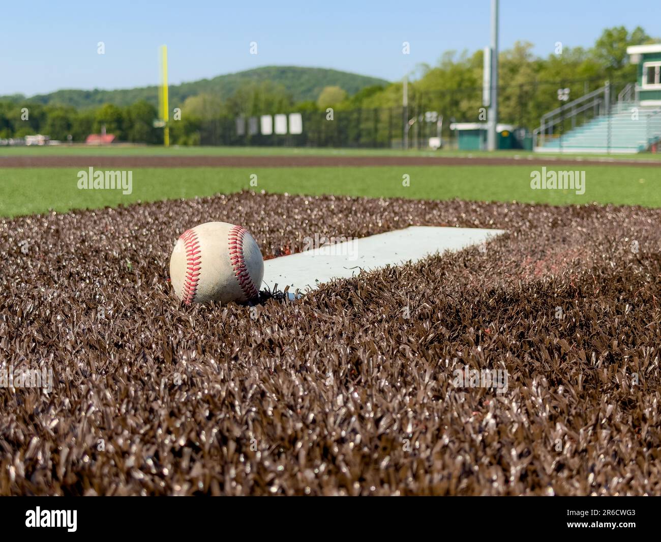 baseball on synthetic turf pitchers mound Stock Photo - Alamy