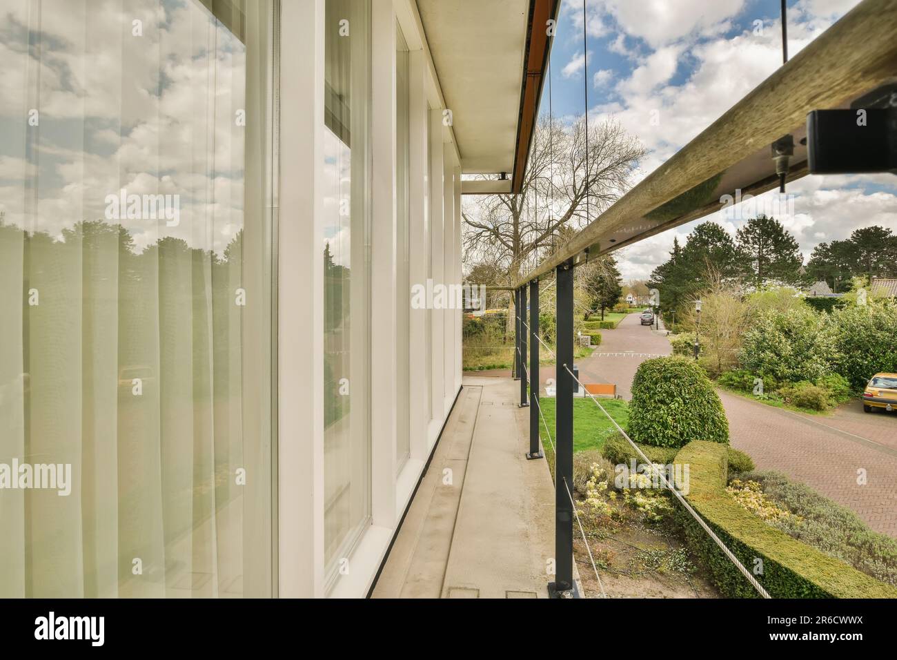 an outside view from inside the house, looking out to the street and ...