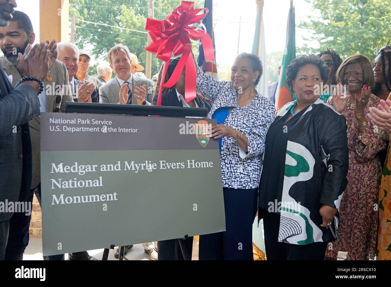 Myrlie Evers, second from right, waves the bow after she and her ...