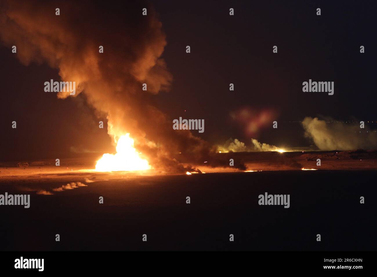 Fireballs from Qatar Emiri Land Force mortars light up the Al Qalayel ...