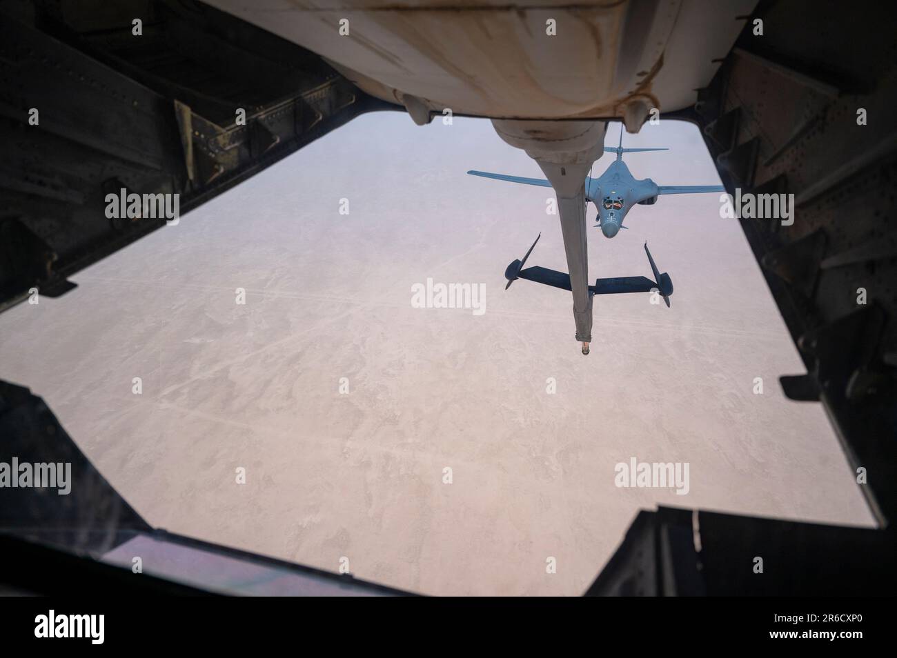 A U.S. Air Force B-1B Lancer approaches a U.S. Air Force KC-10A ...