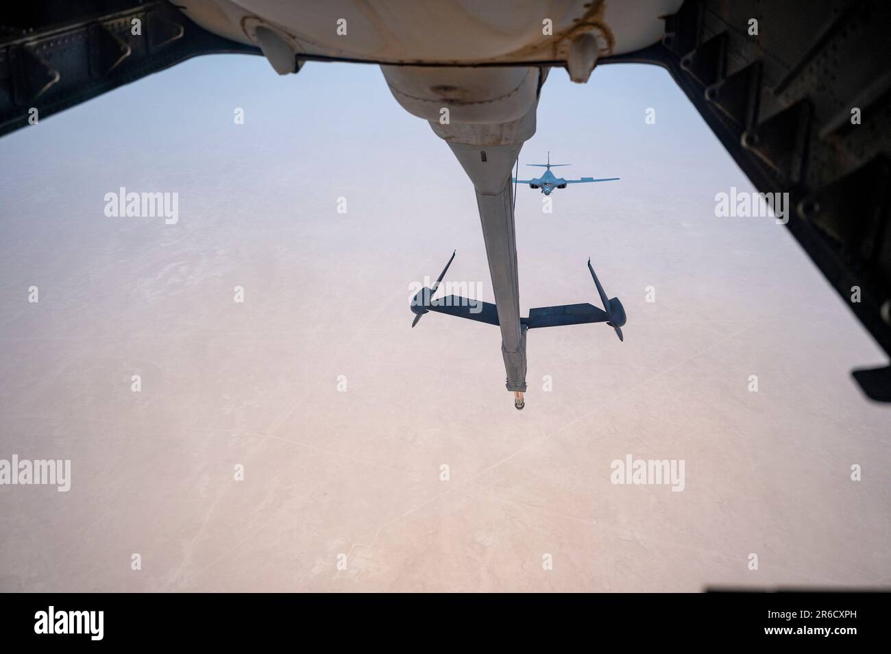 A U.S. Air Force B-1B Lancer approaches a U.S. Air Force KC-10A ...