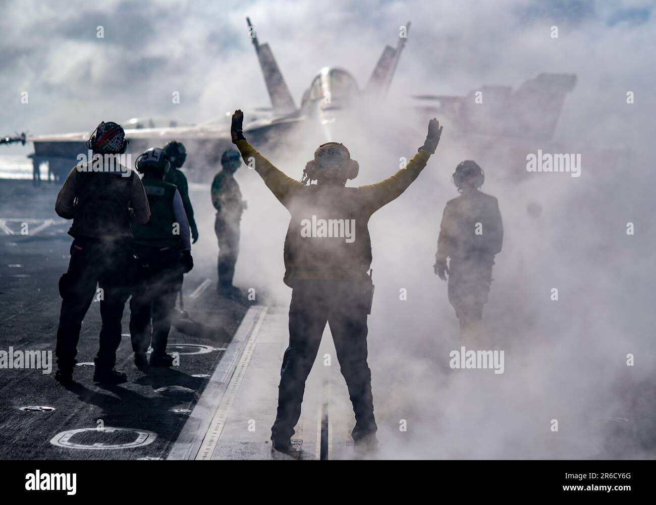 230608-N-DU622-1062 PACIFIC OCEAN (June 8, 2023) A U.S. Navy Sailor directs an F/A-18E Super ...