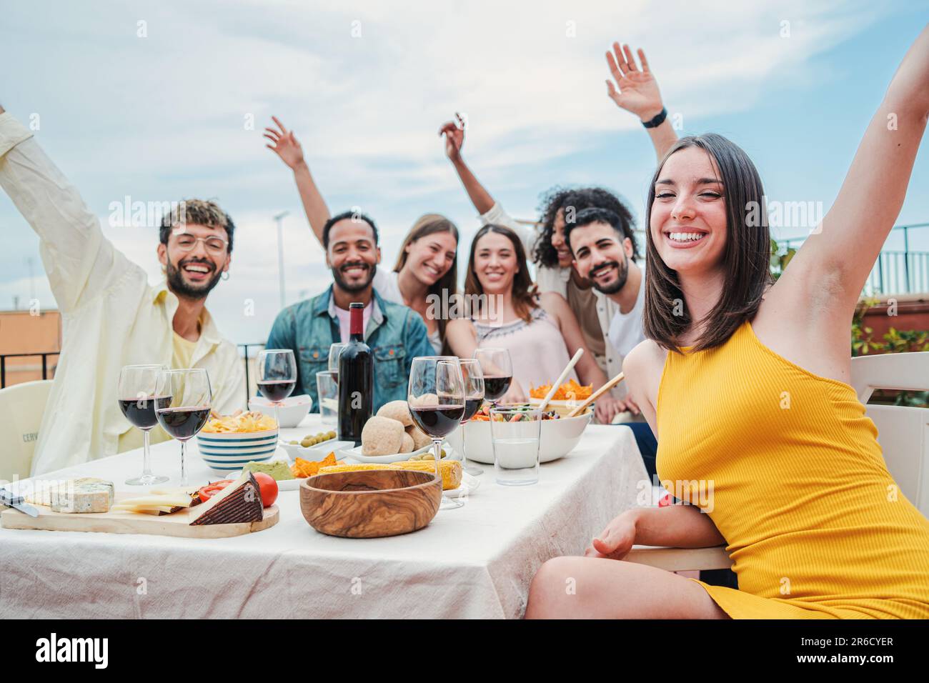 Group of young adult friends having fun and laughing on a dinner party ...