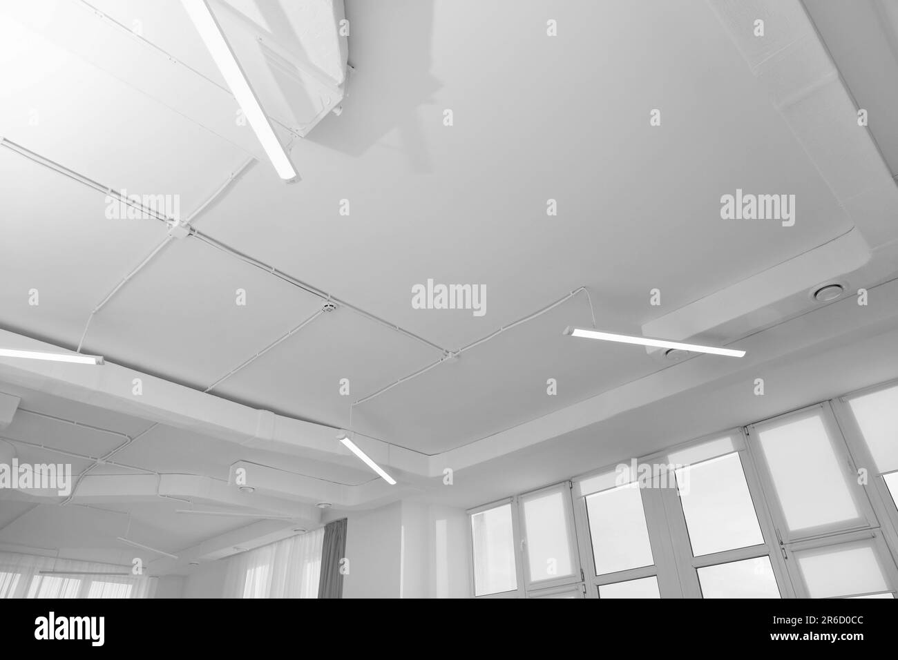 White ceiling with modern lighting in office Stock Photo - Alamy