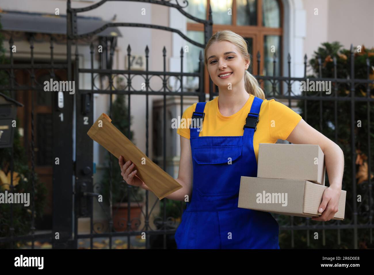 Female courier in uniform hi-res stock photography and images - Alamy