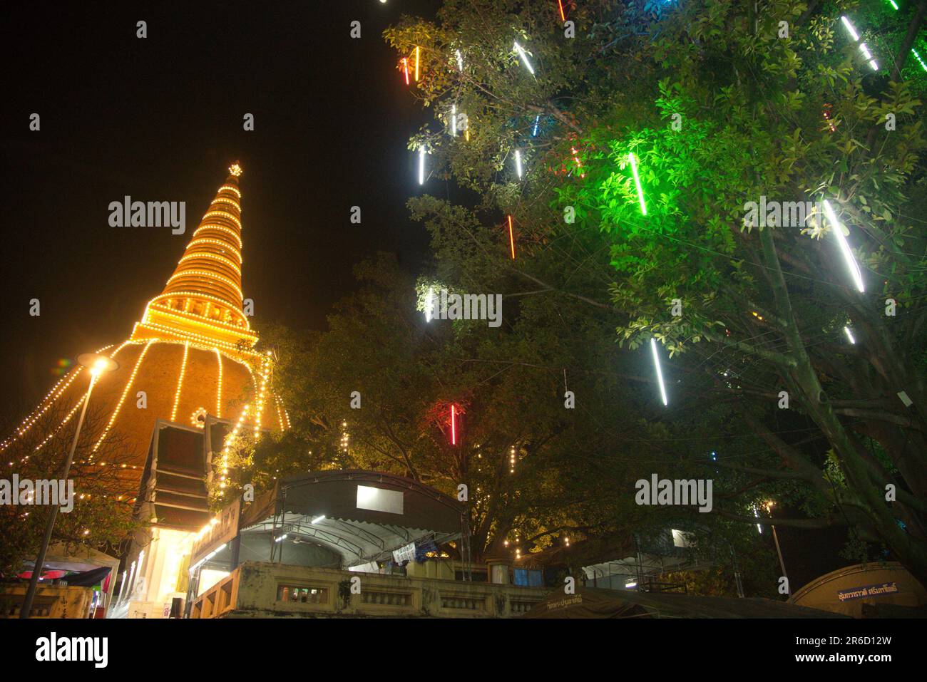 Colorful night lights at Wat Phra Pathom Chedi temple. The largest ...