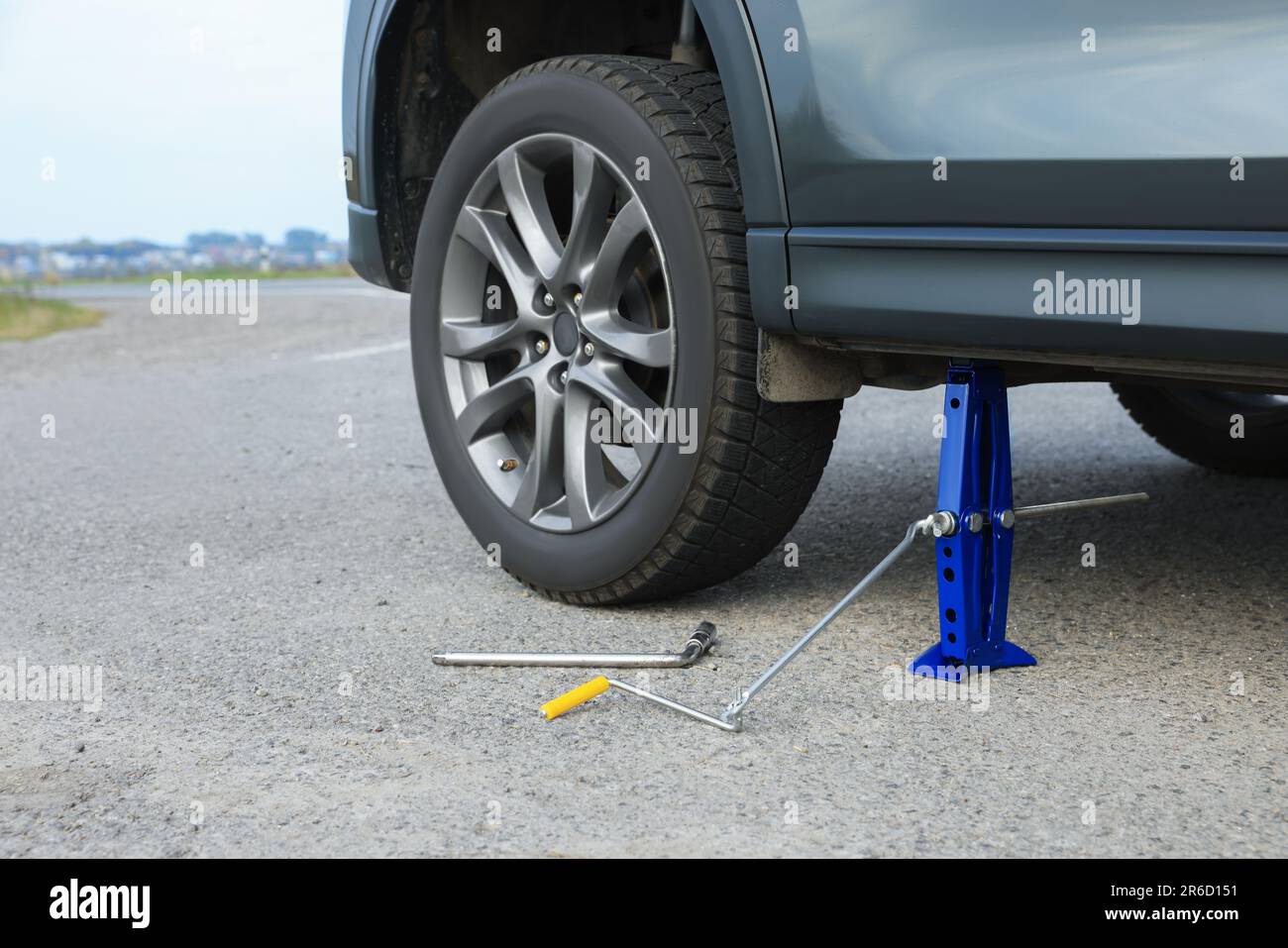 Car without wheel lifted hi-res stock photography and images - Alamy