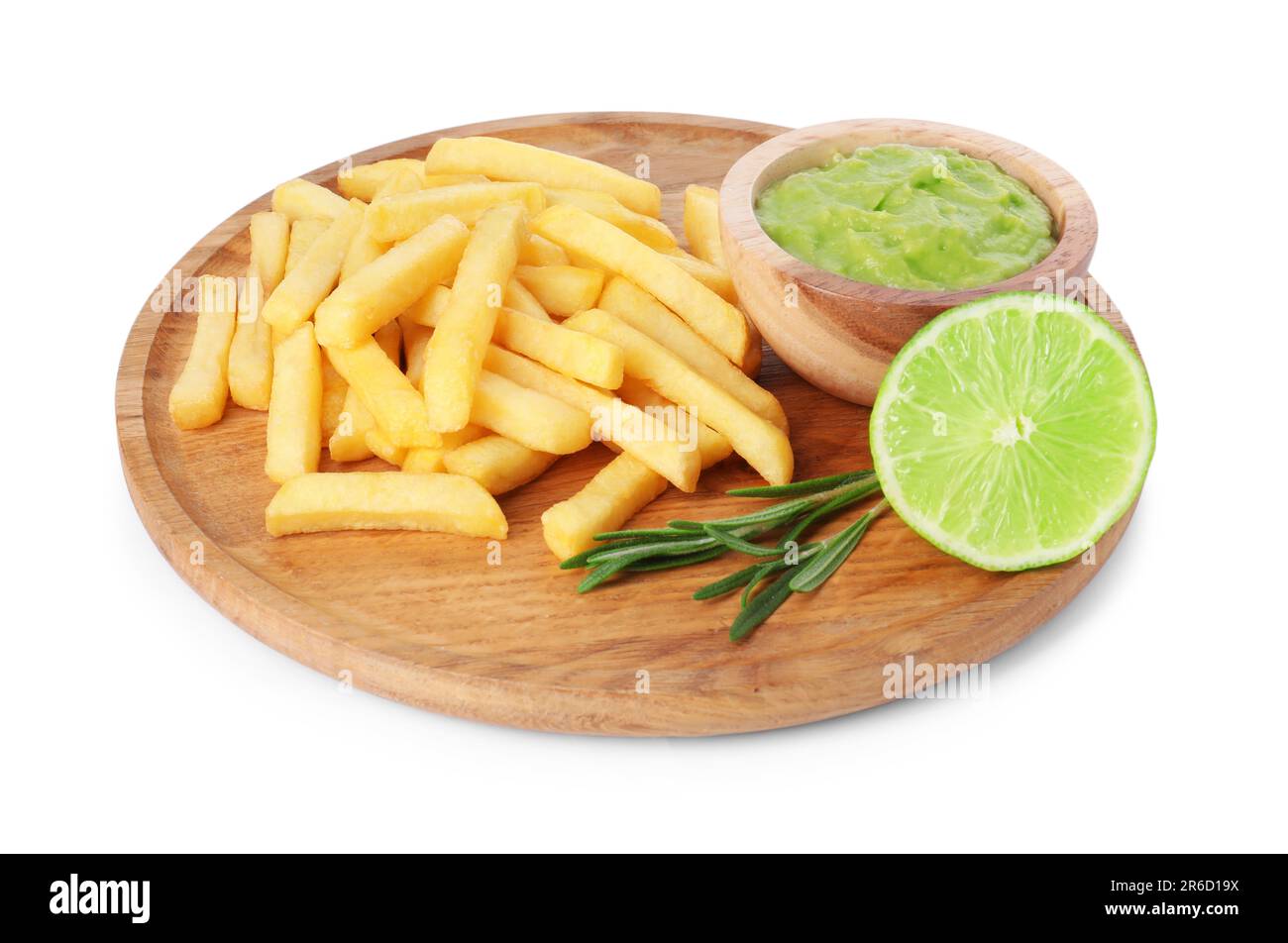 Tray with delicious french fries, avocado dip, lime and rosemary ...