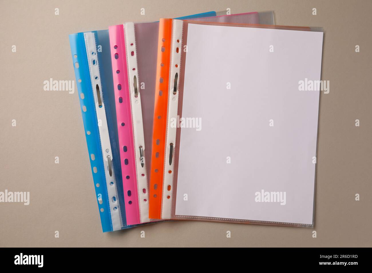File folders with punched pockets on light grey background, flat lay ...