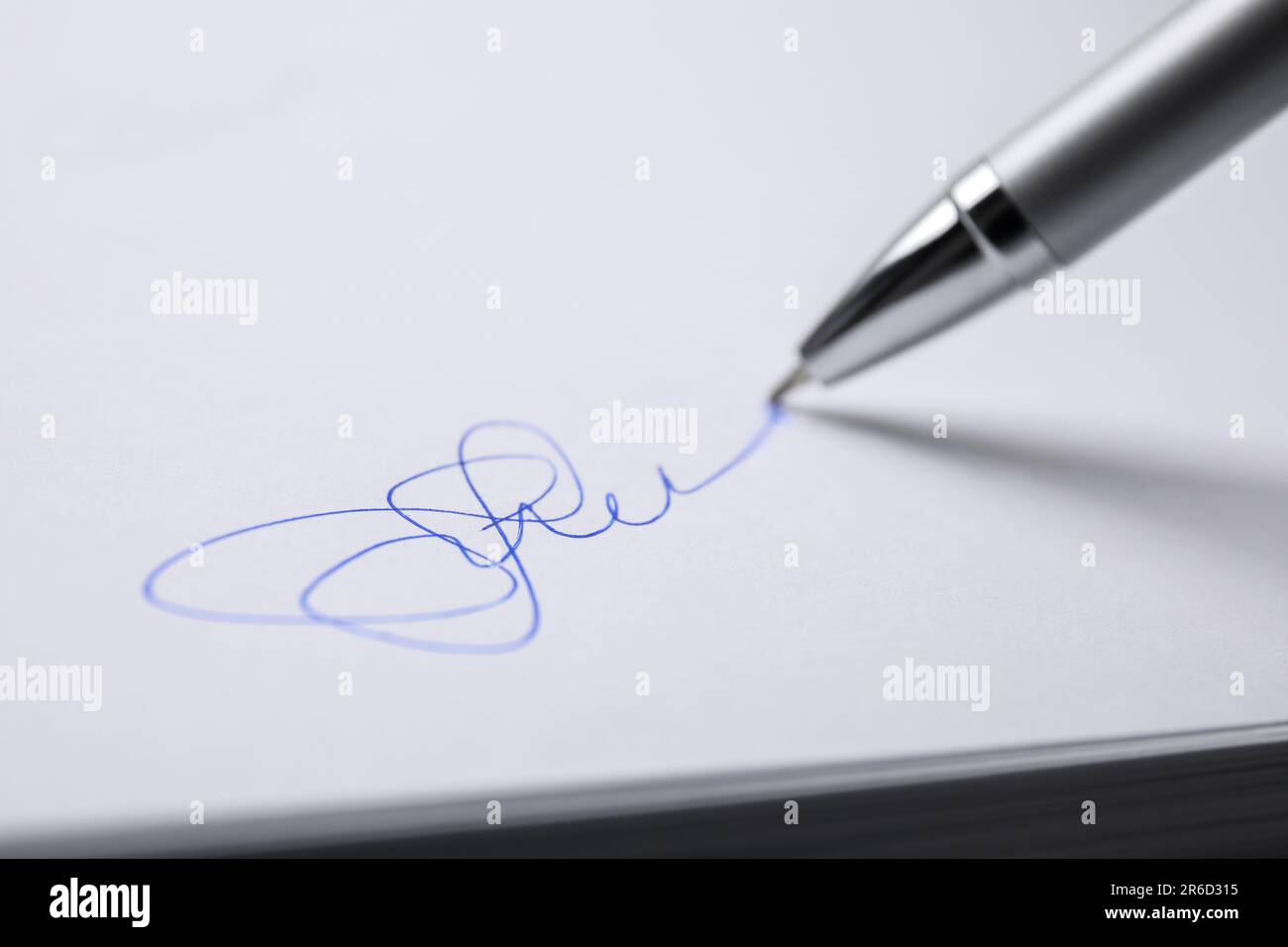 Signing sign ballpoint blue signature hi-res stock photography and ...