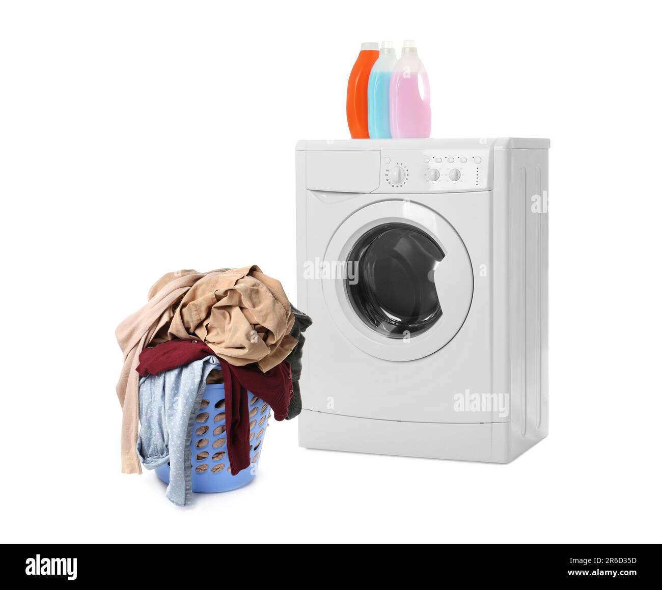 Washing machine, detergents and plastic laundry basket full of clothes ...