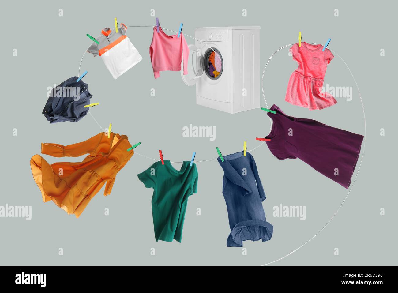 Drying laundry. Rope with different clothes flying out from washing ...