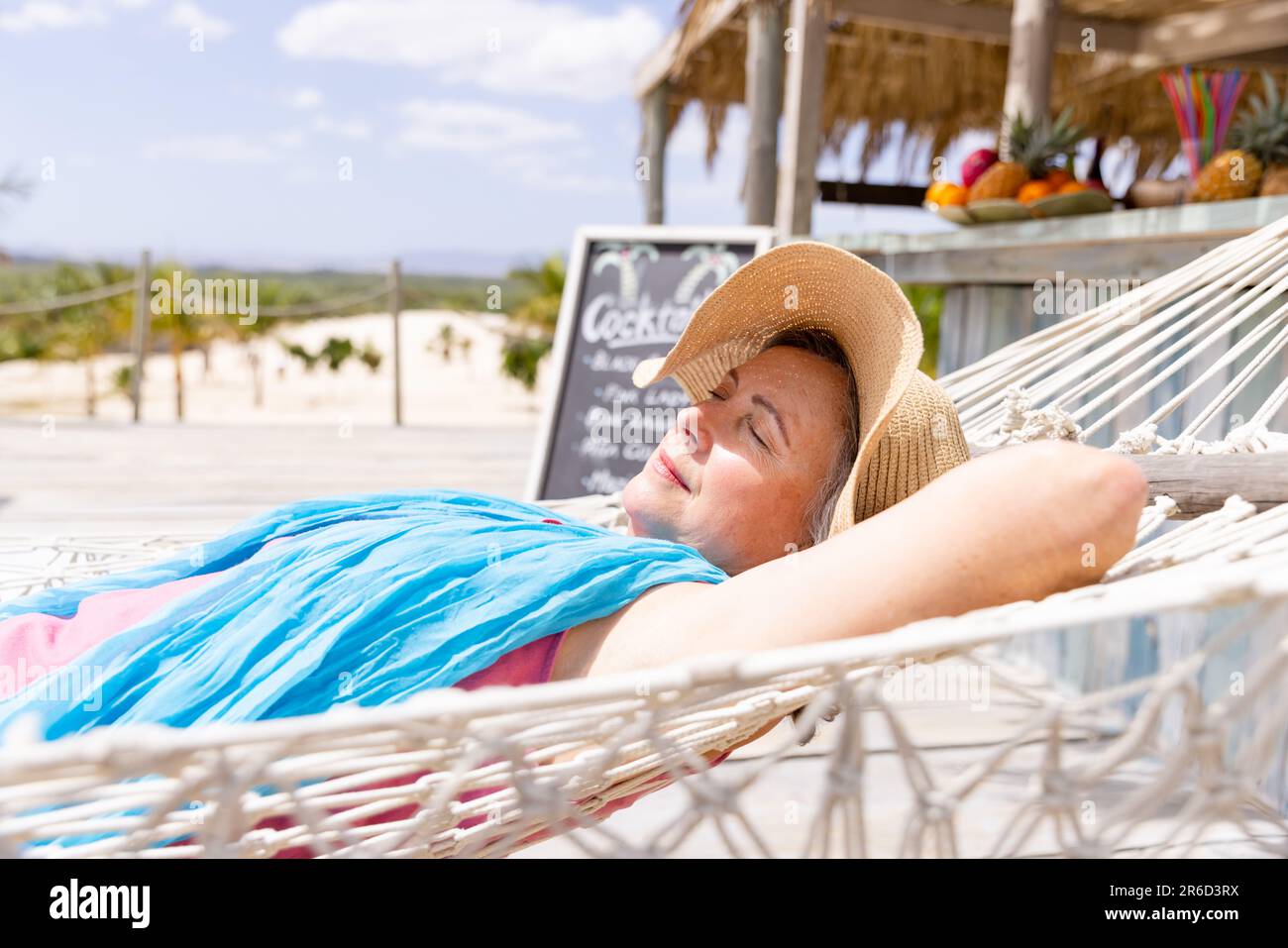Woman sleeping on beach hi-res stock photography and images - Alamy