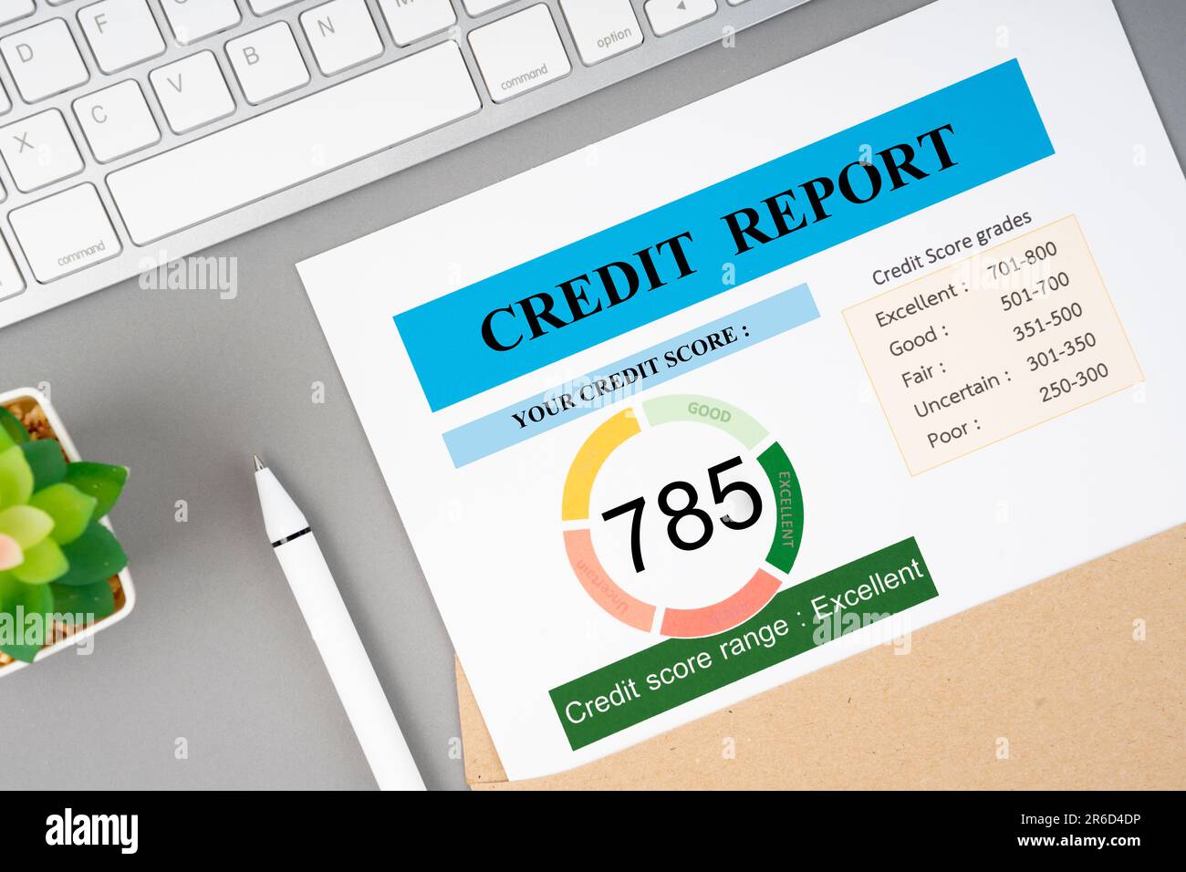 Credit score report document and pen with computer keyboard on desk ...