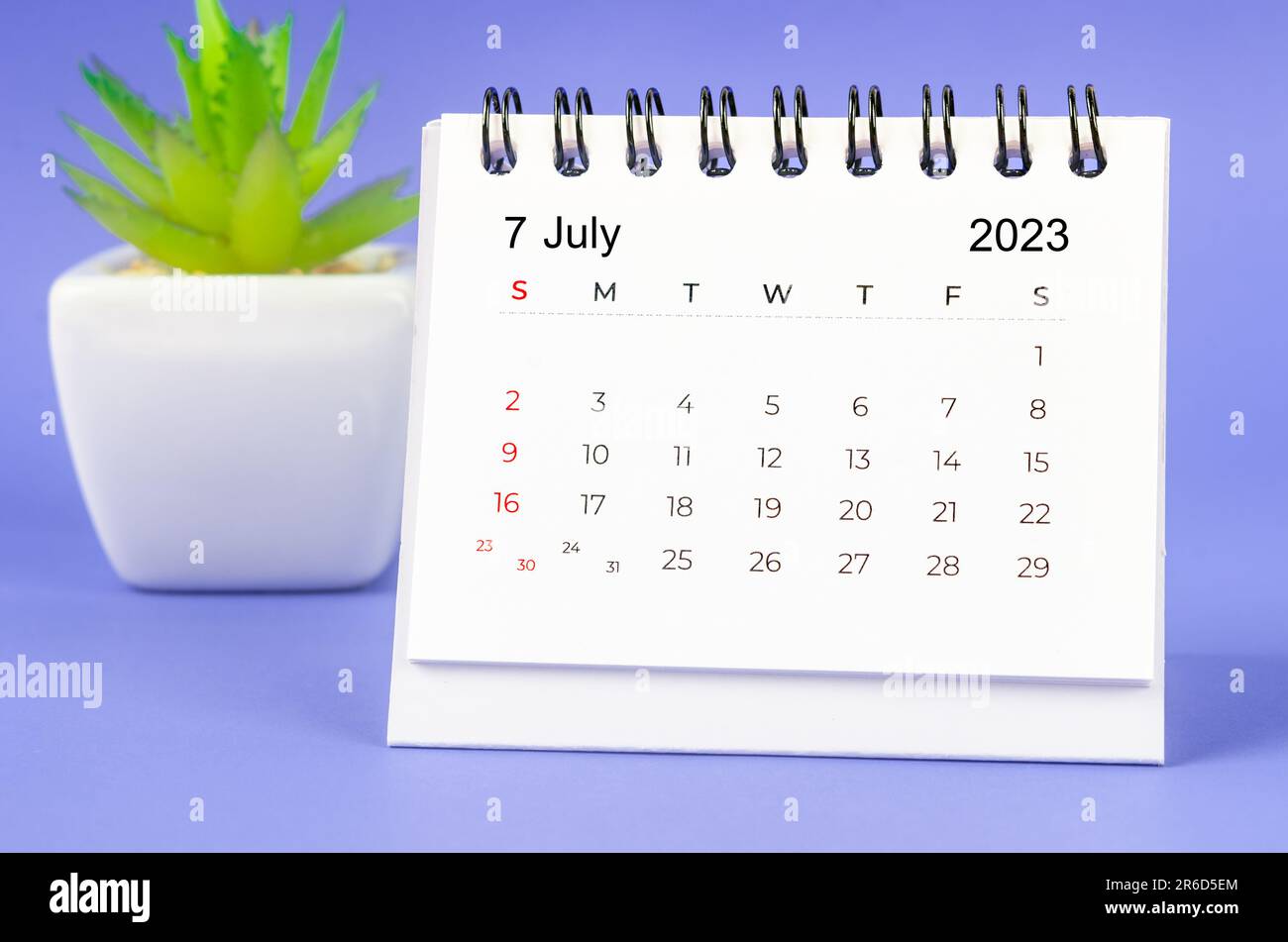 July 2023 Monthly desk calendar for 2023 year on purple background ...