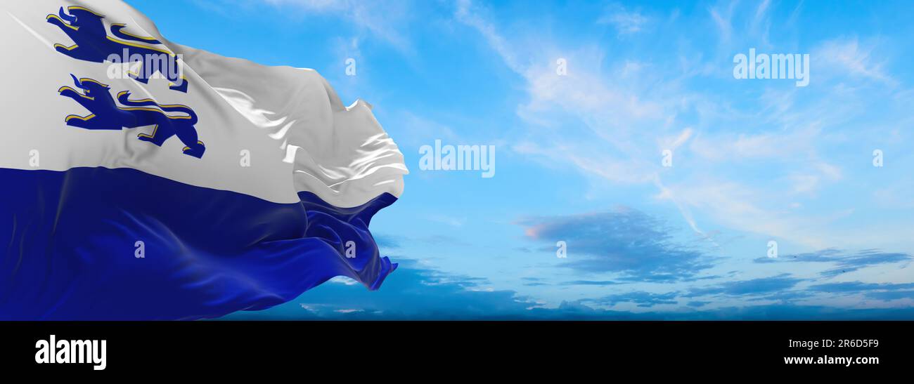 flag of German peoples North Sleswick Germans at cloudy sky background ...