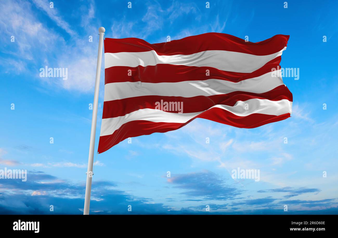 flag of Indo-Aryan ethnoreligious groups Sarnaists at cloudy sky ...