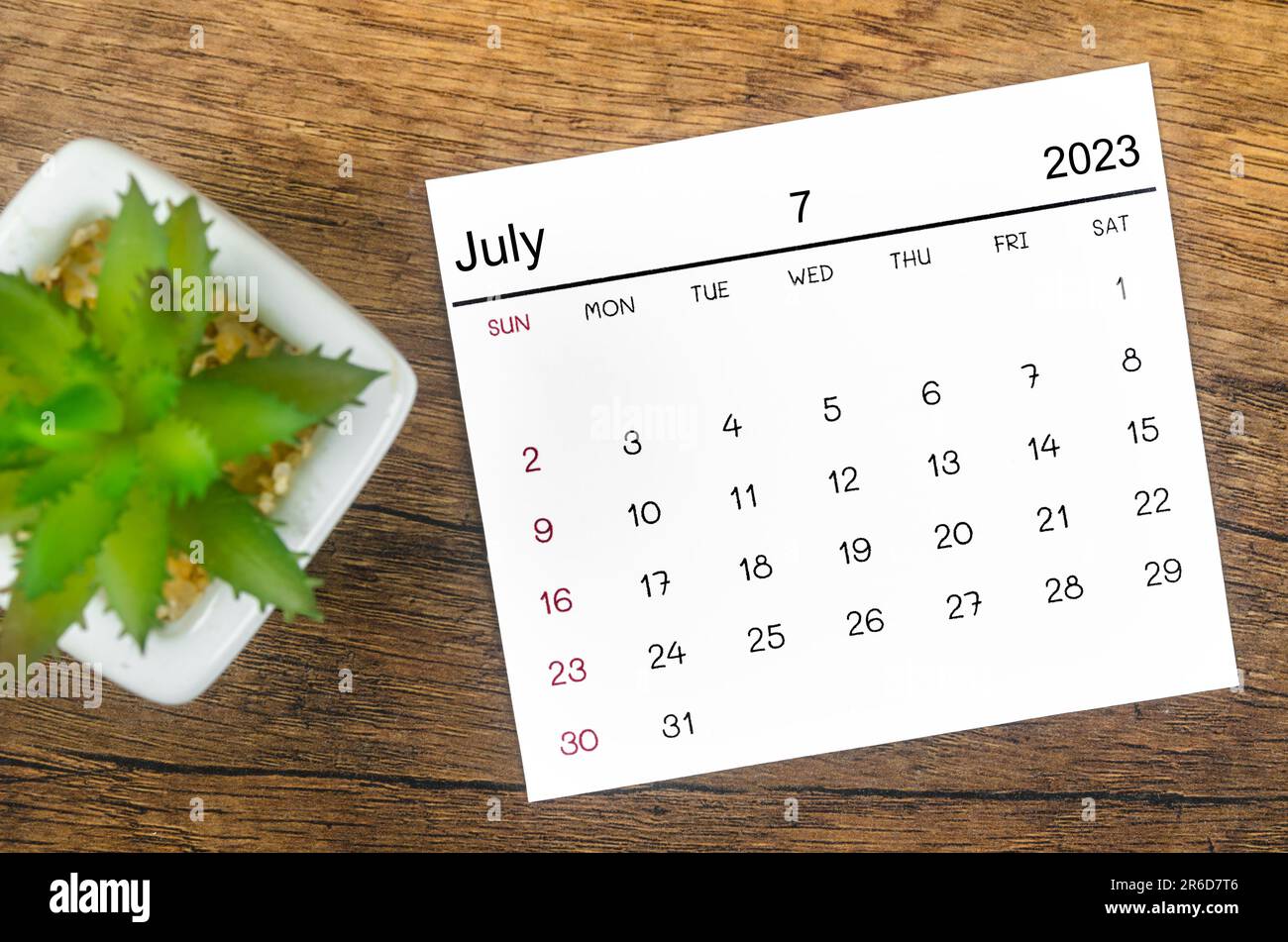 July 2023 Monthly calendar for 2023 year on wooden background Stock ...
