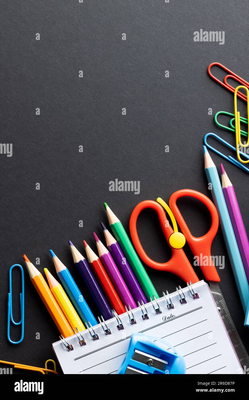 Close up of coloured pencils and school materials with copy space on ...