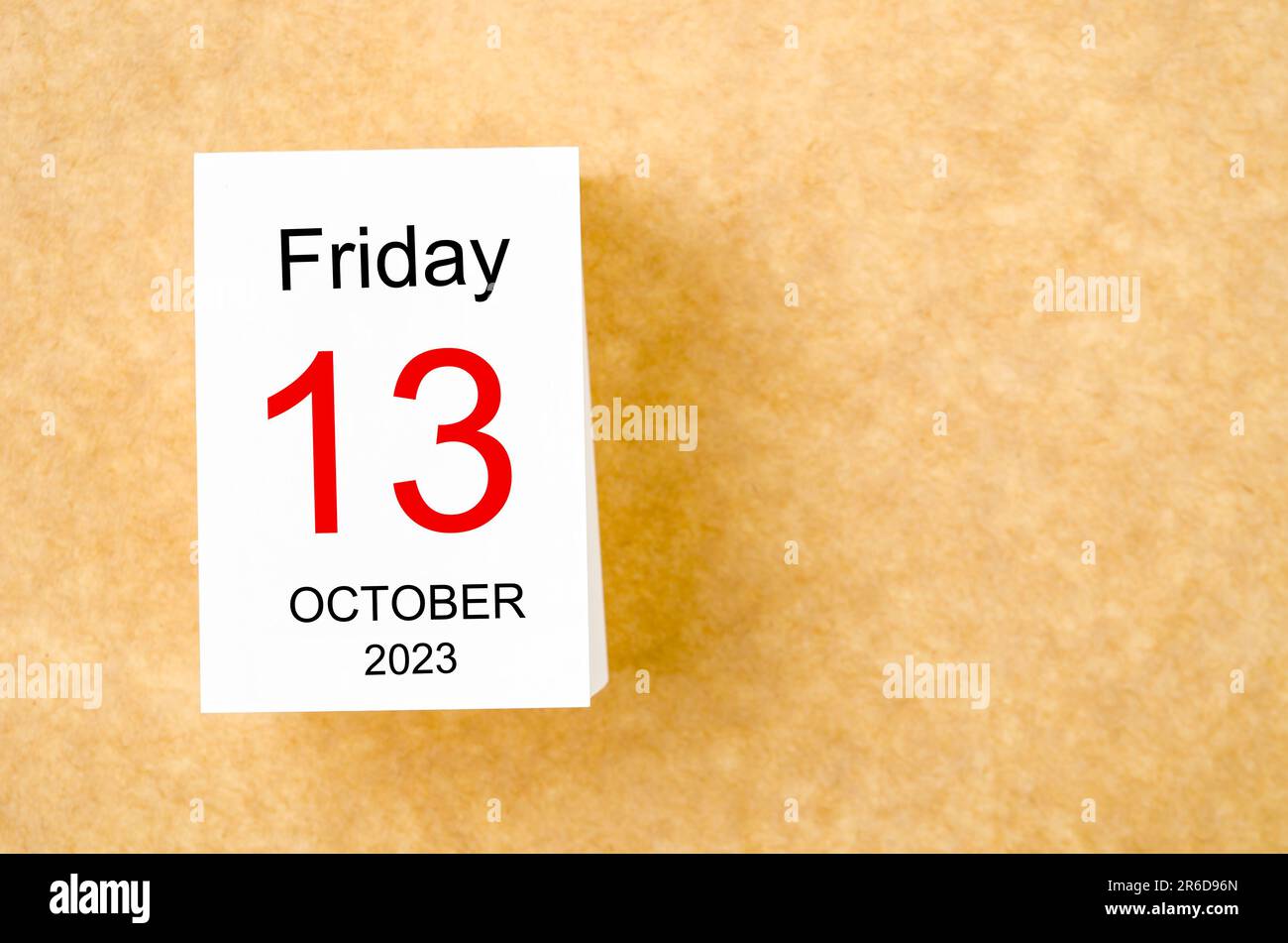 Friday the 13th on mini calendar with on old yellow paper background ...