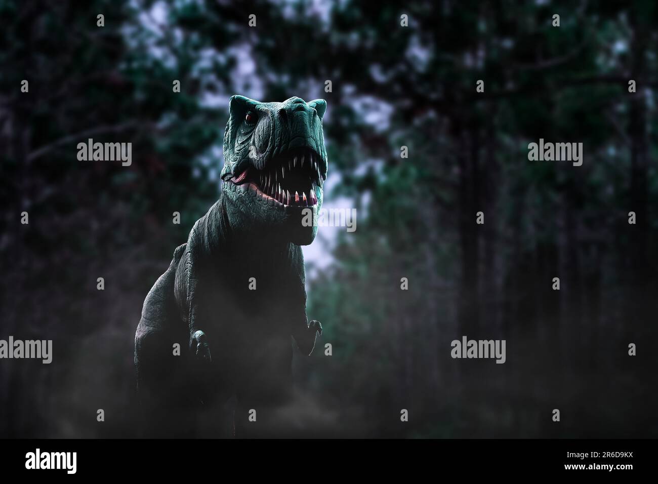 Tyrannosaurus rex statue in the forest fear predator Stock Photo - Alamy