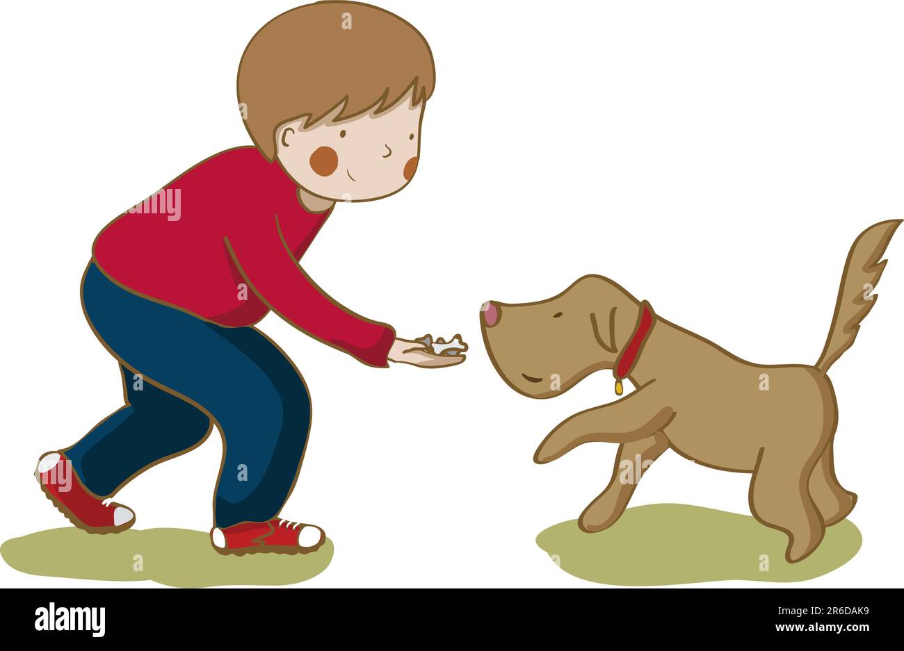 Boy feeding dog Cut Out Stock Images & Pictures - Alamy
