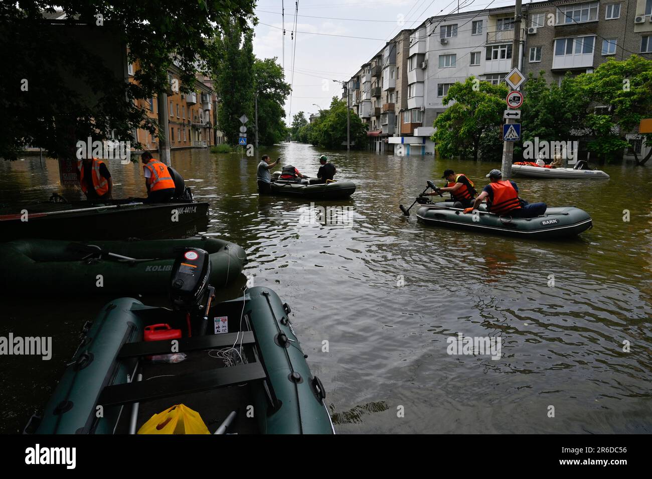Kherson, Ukraine. 08th June, 2023. Volunteers float in boats during an ...
