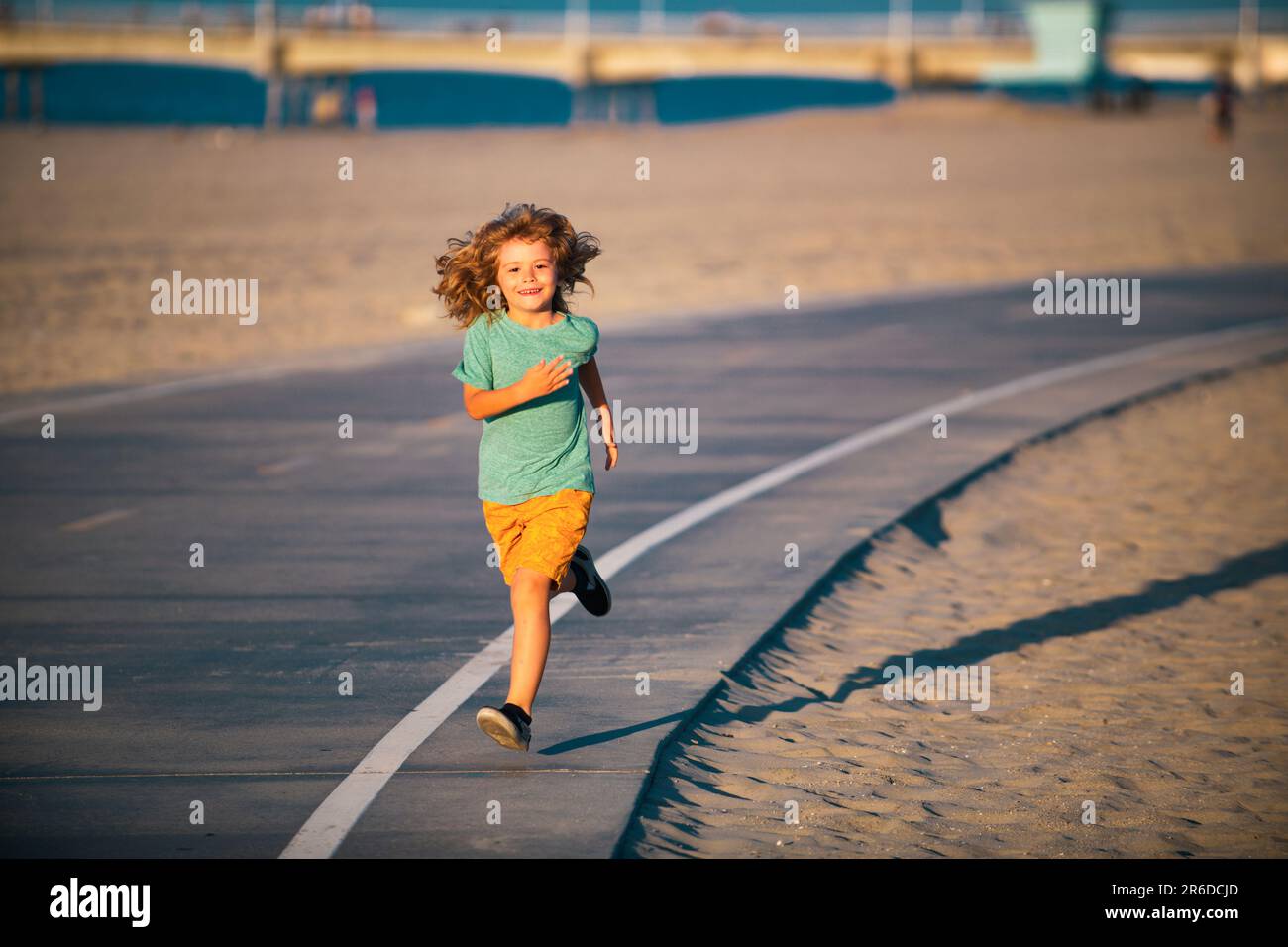 Cheerful child boy running to school. Kids run race Stock Photo - Alamy