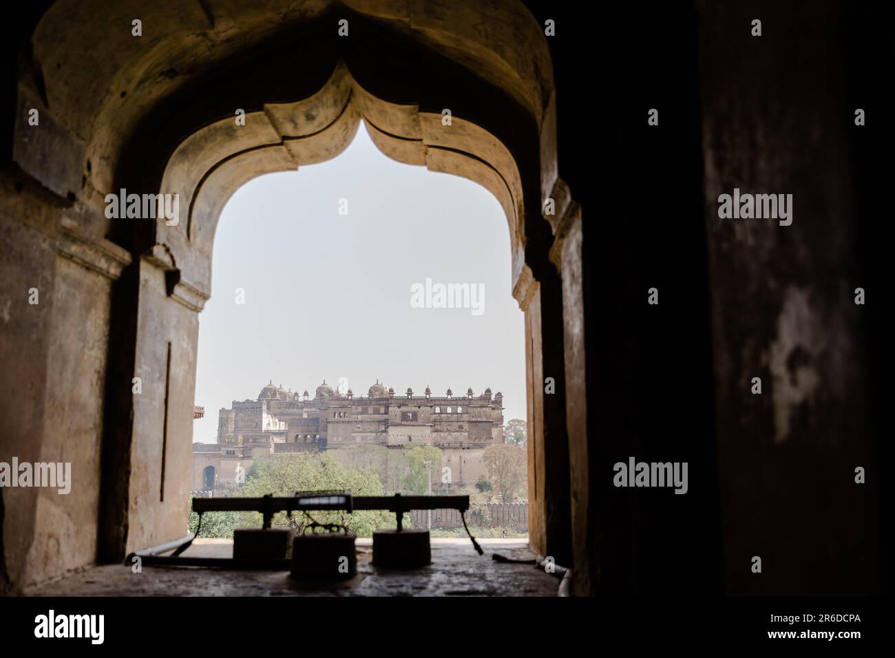 A view of a historic town from the inside of an open arched window in ...
