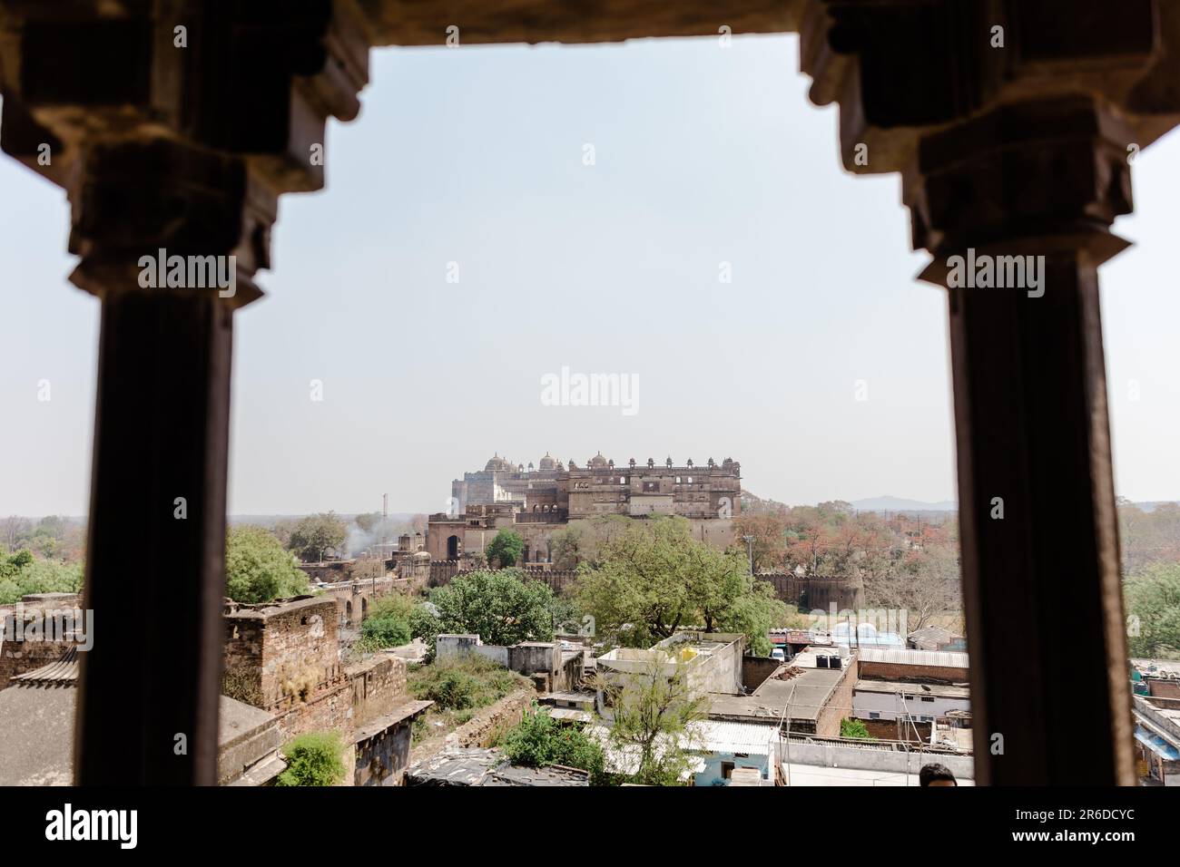A view of a historic town from the inside of an open arched window in ...