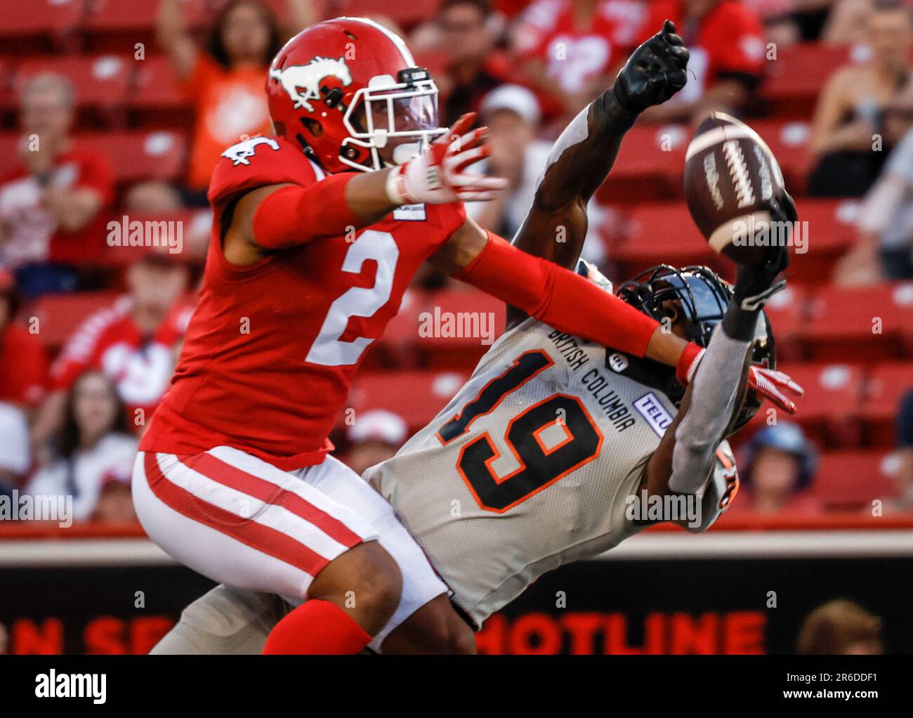 B.C. Lions wide receiver Dominique Rhymes, right, reaches for a pass as ...