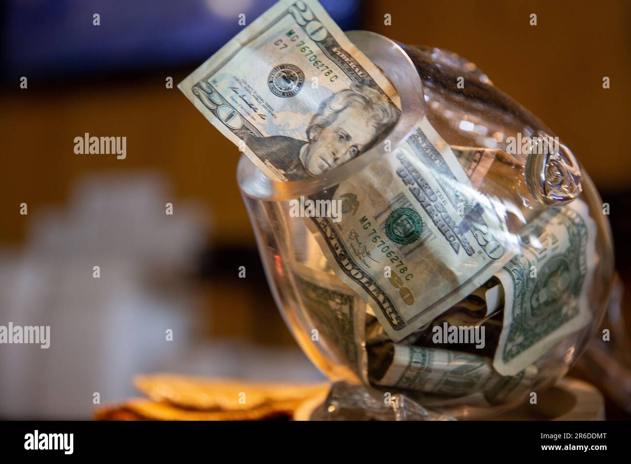 Tip jar with a 20 as gratuity fpr the sushi chef Stock Photo - Alamy