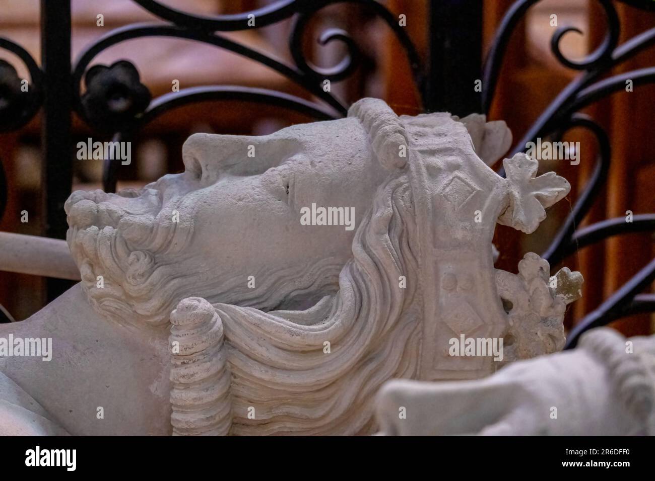 Stone carved statues of royalty lying in state in close up photo ...