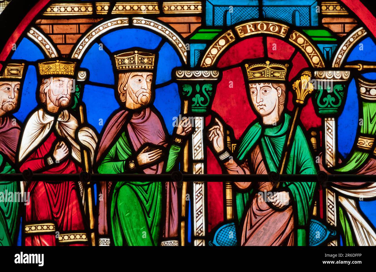close up detail of stained glass panel showing four kings in colorful ...