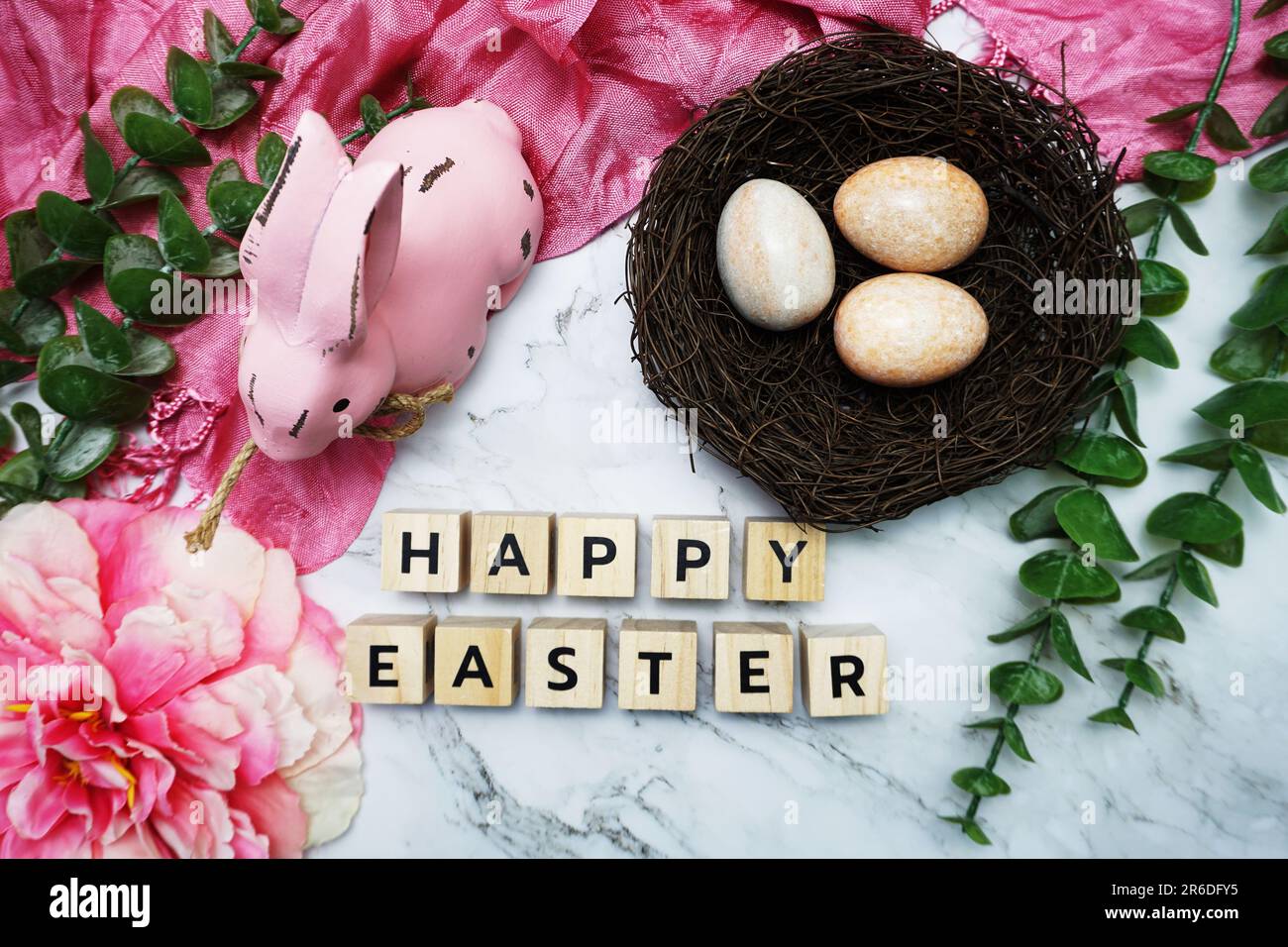 Happy Easter alphabet letter with bird nest and flower decoration on ...