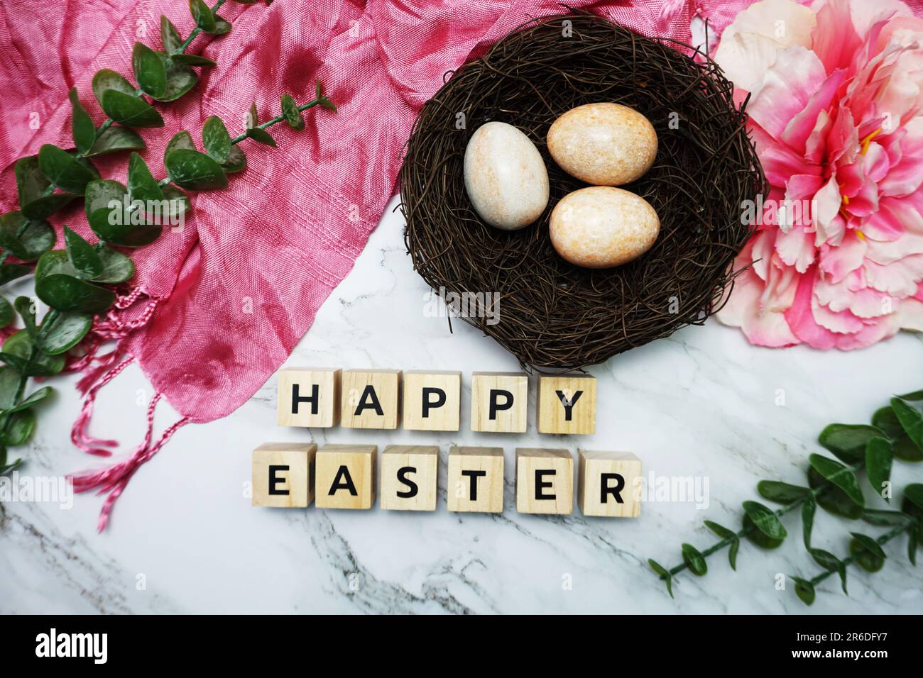Happy Easter alphabet letter with bird nest and flower decoration on ...