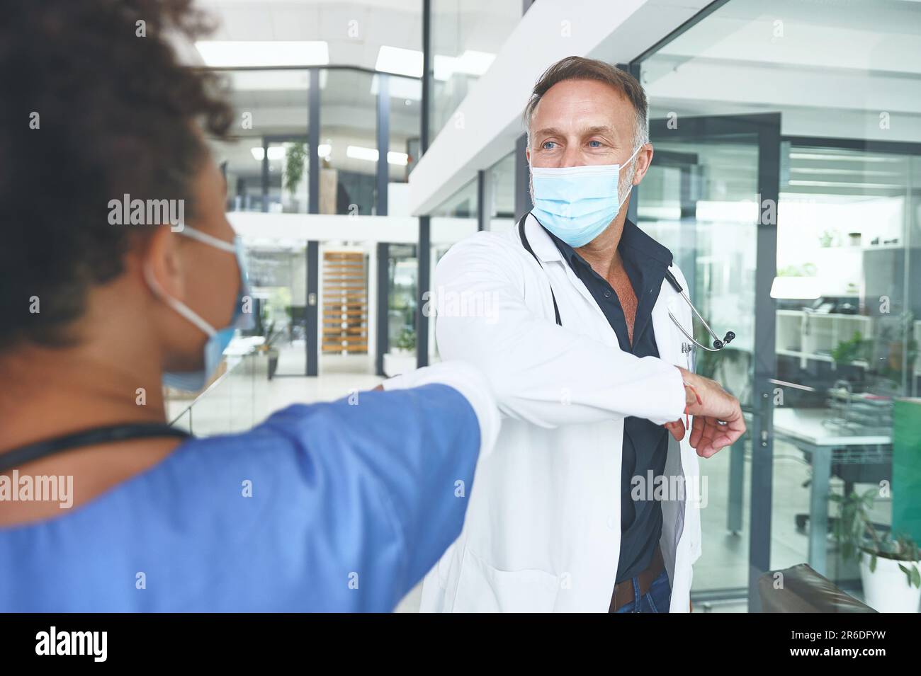 There will be no spreading of germs here. a handsome mature doctor ...