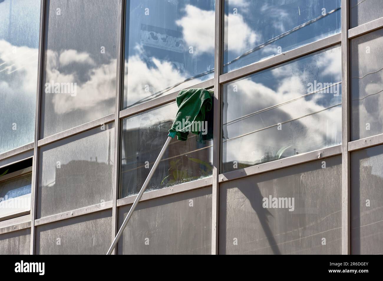 window washing, washing a street shop window Stock Photo - Alamy
