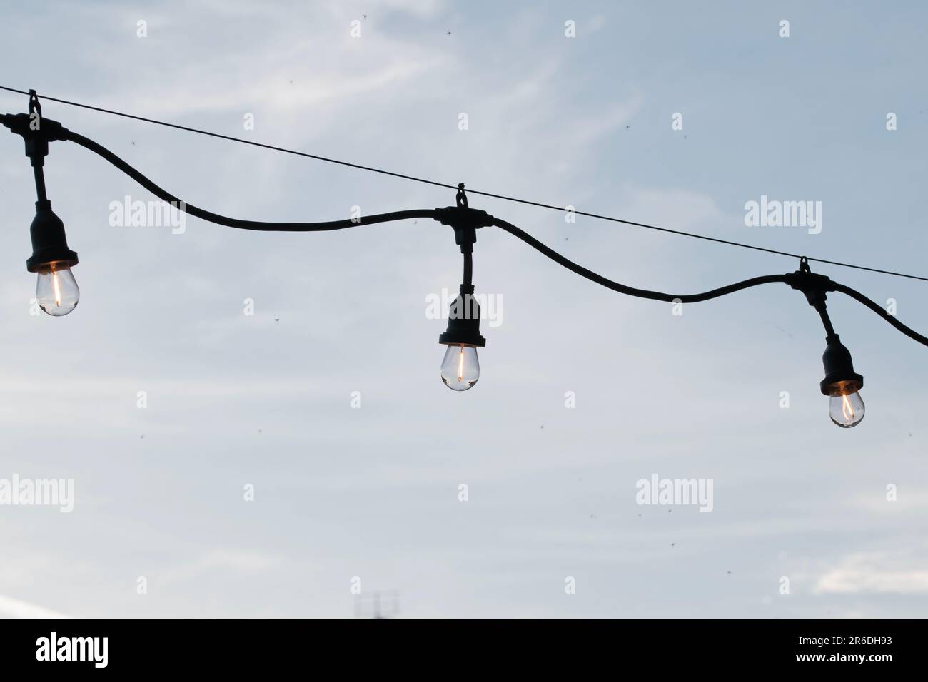 Image of string lights early evening with sky in the background Stock ...