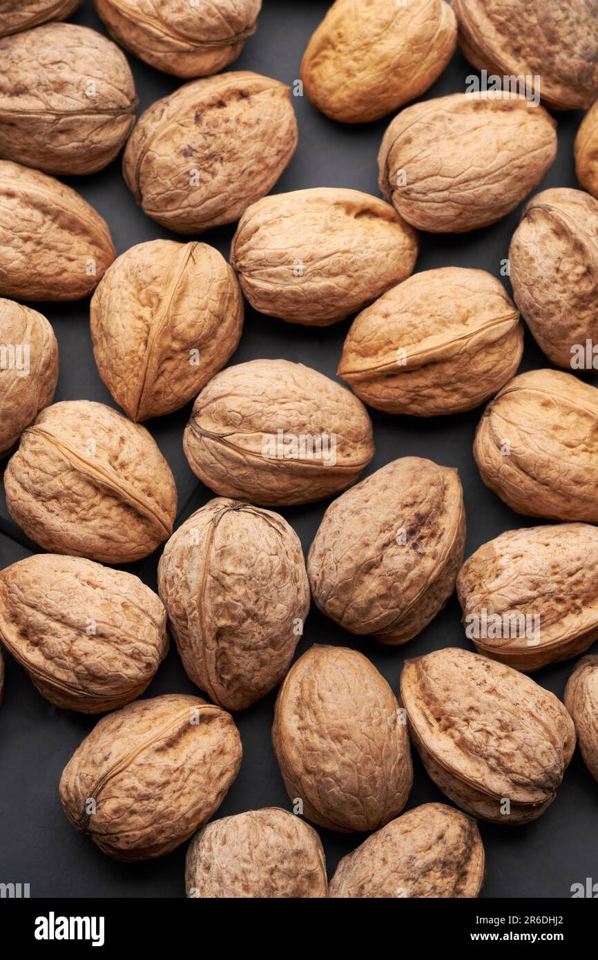 Whole walnuts nuts with shells close-up background studio shot Stock ...