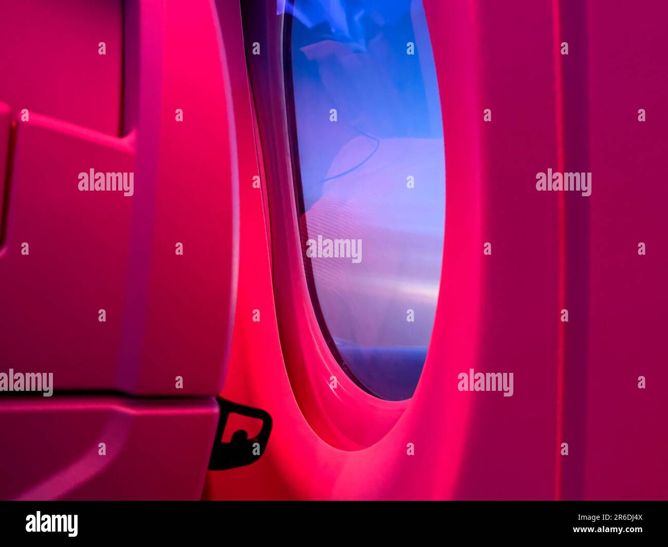 Airplane window from where you can see the wing of the commercial wide ...