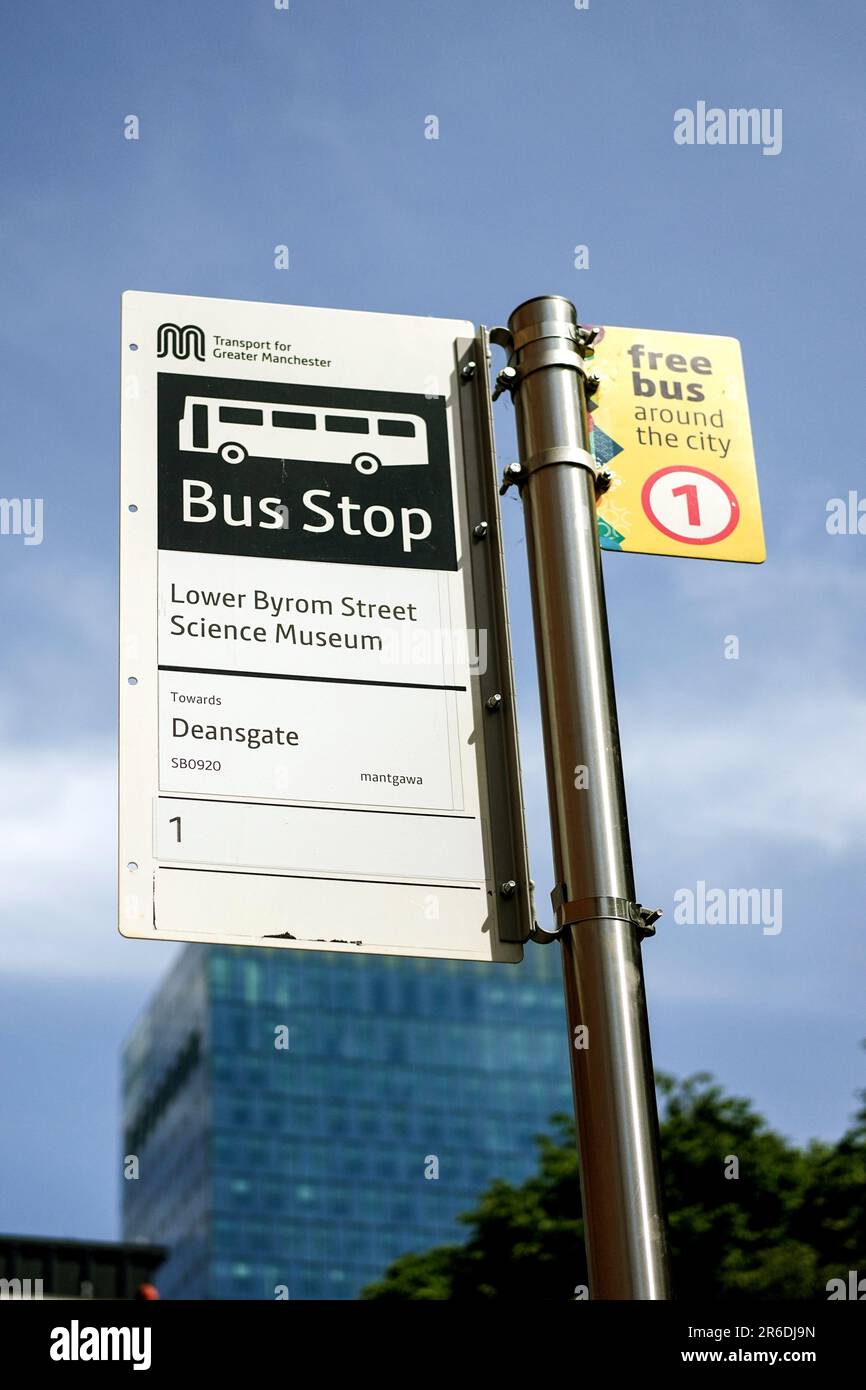 Bus stop sign in Manchester UK Stock Photo - Alamy