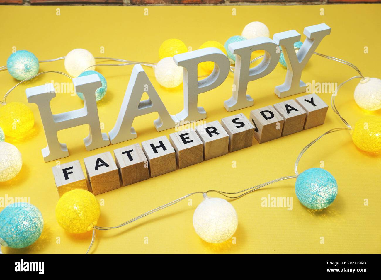 Happy Fathers Day alphabet letter with LED cotton balls on yellow ...