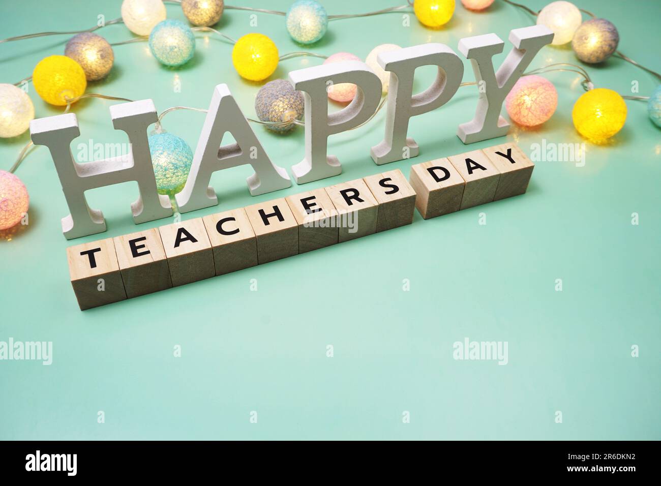 Happy Teachers Day alphabet letter with LED cotton balls on green ...