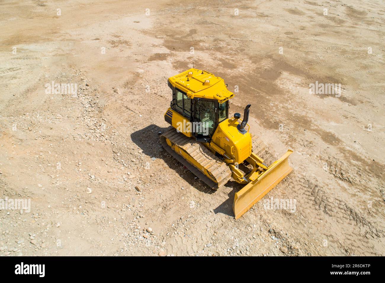 aerial view of a yellow bulldozer working at a construction site Stock ...