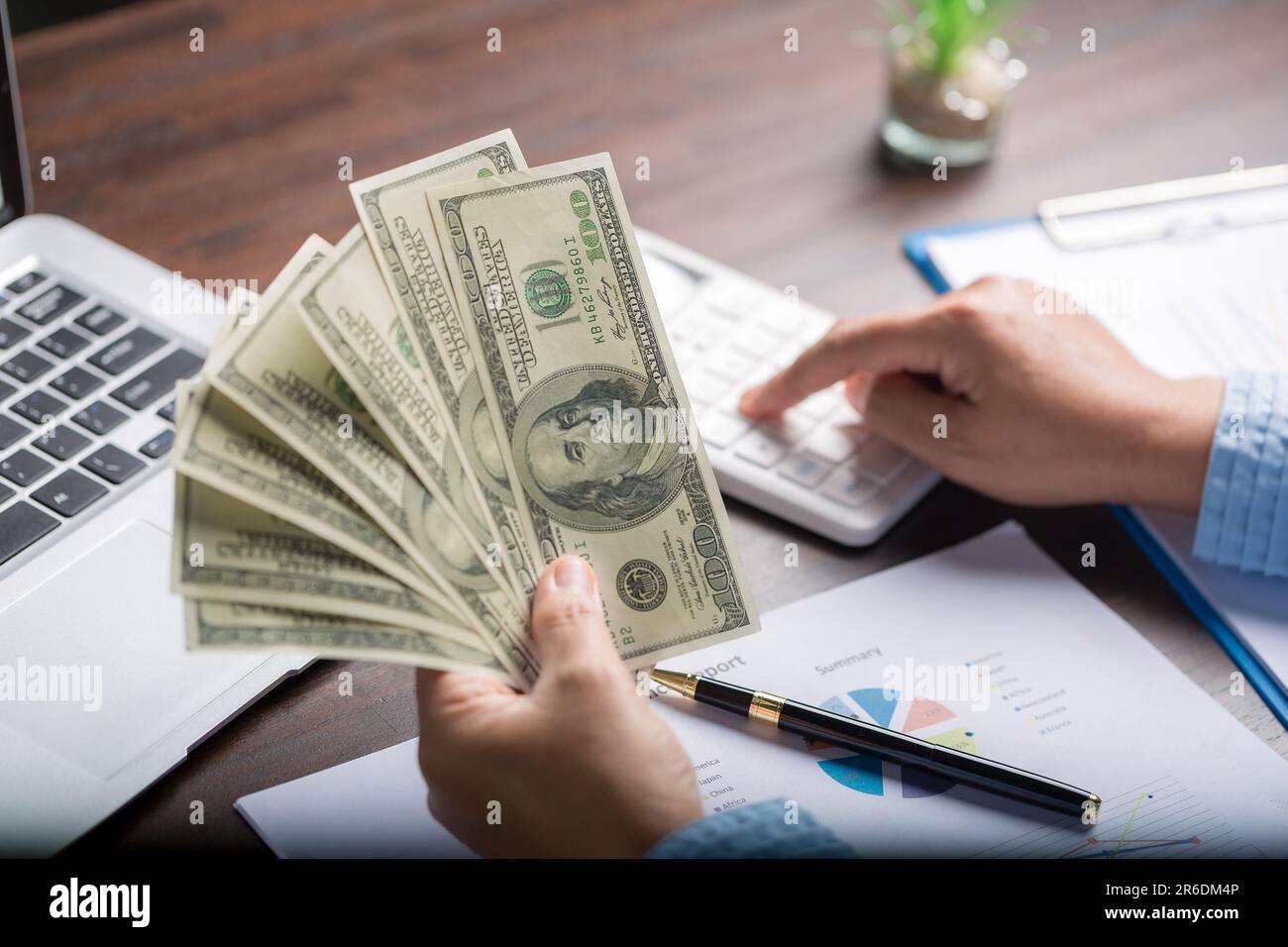 Close up young business woman using counting cash money one hundred ...