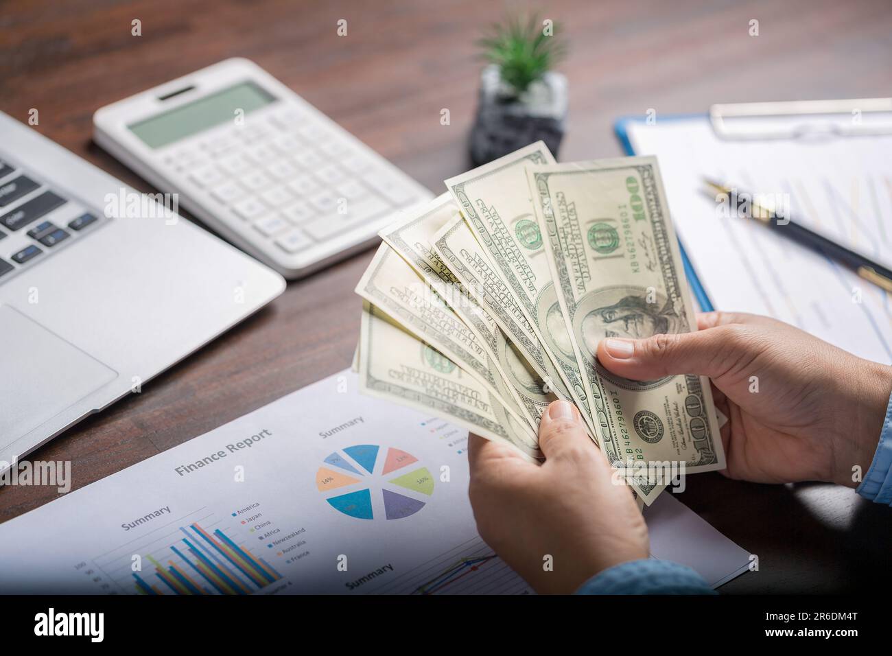 Close up young business woman using counting cash money one hundred ...