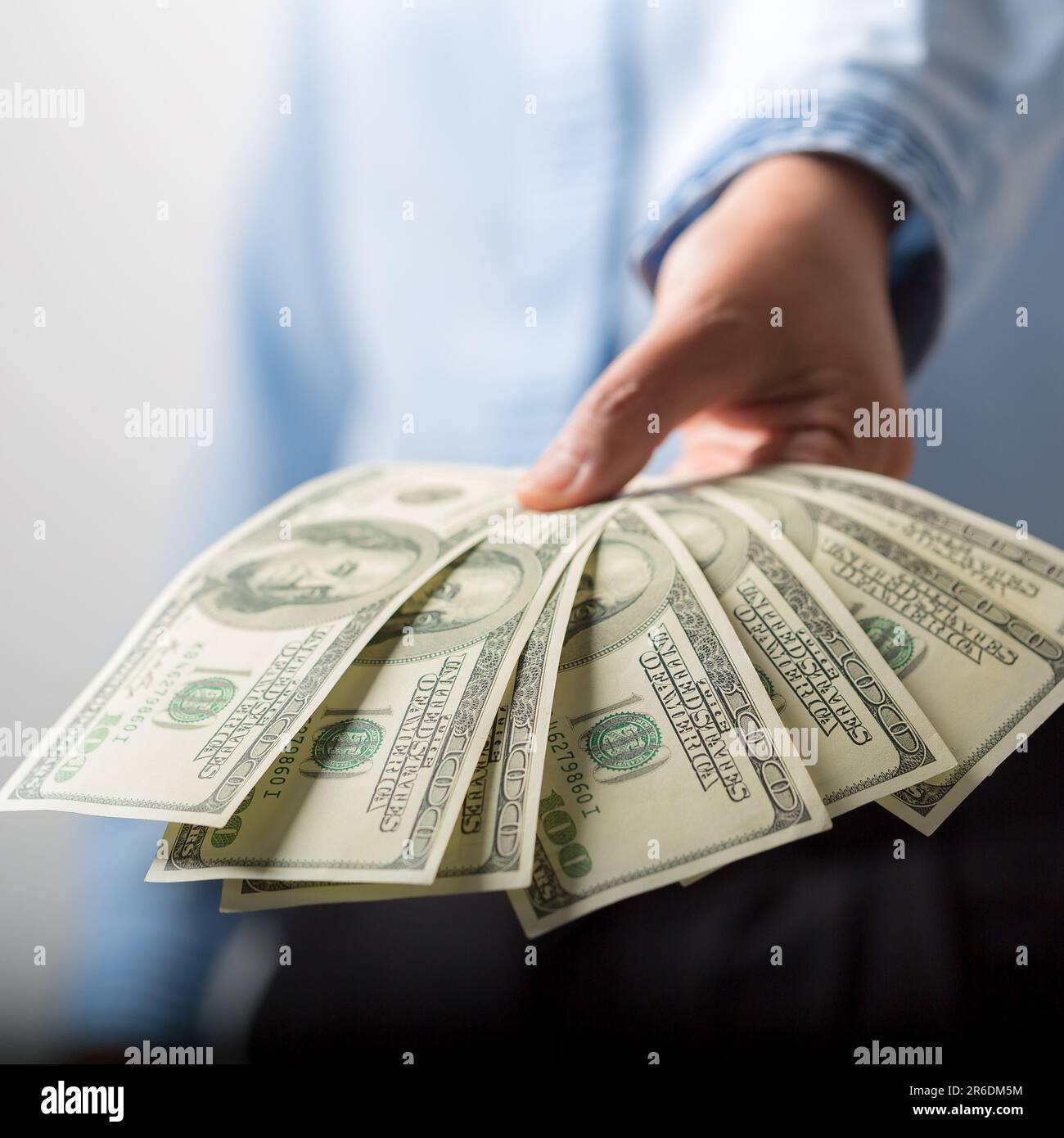 Close up of woman hand holding 100 dollar bills. success business ...
